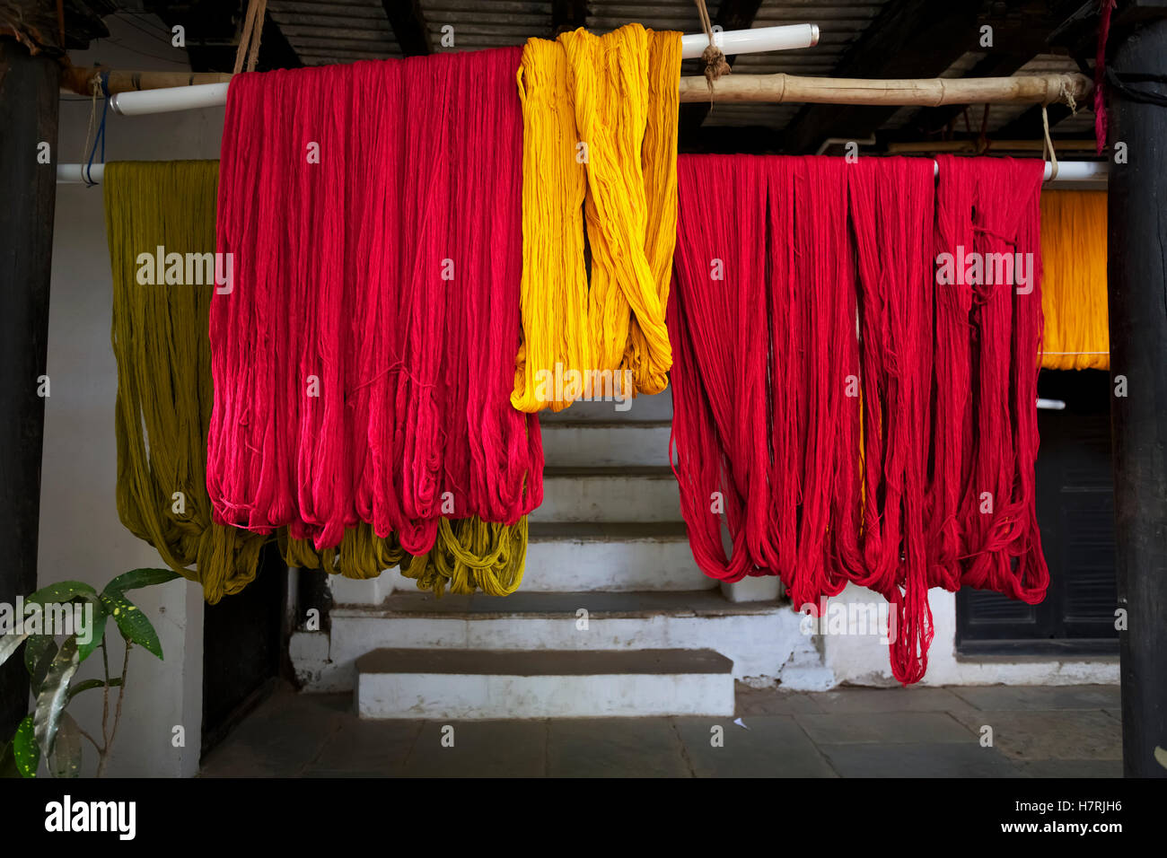 Colourful recently dyed thread hanging out to dry at weavers Stock ...