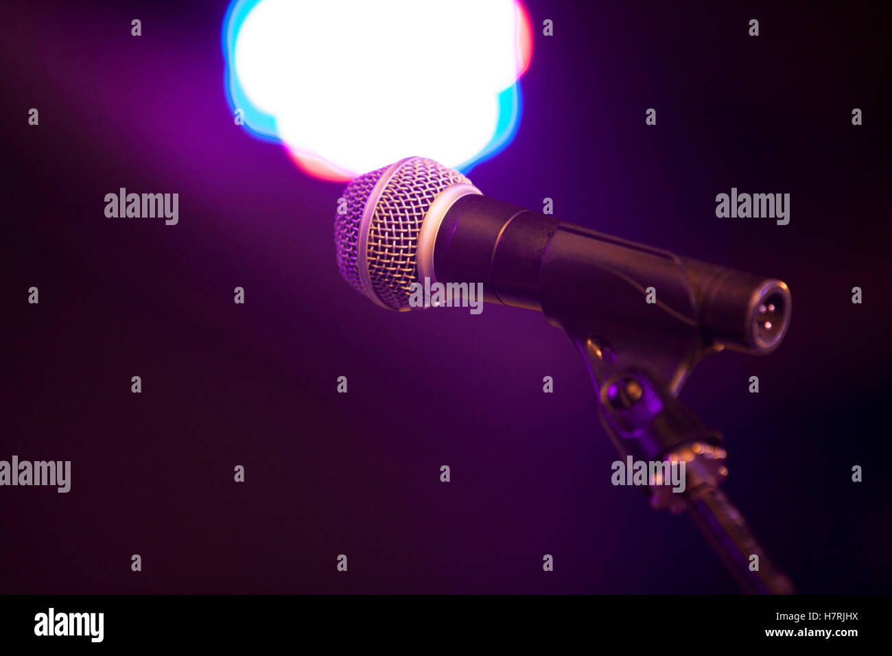 Microphone on stage Stock Photo - Alamy