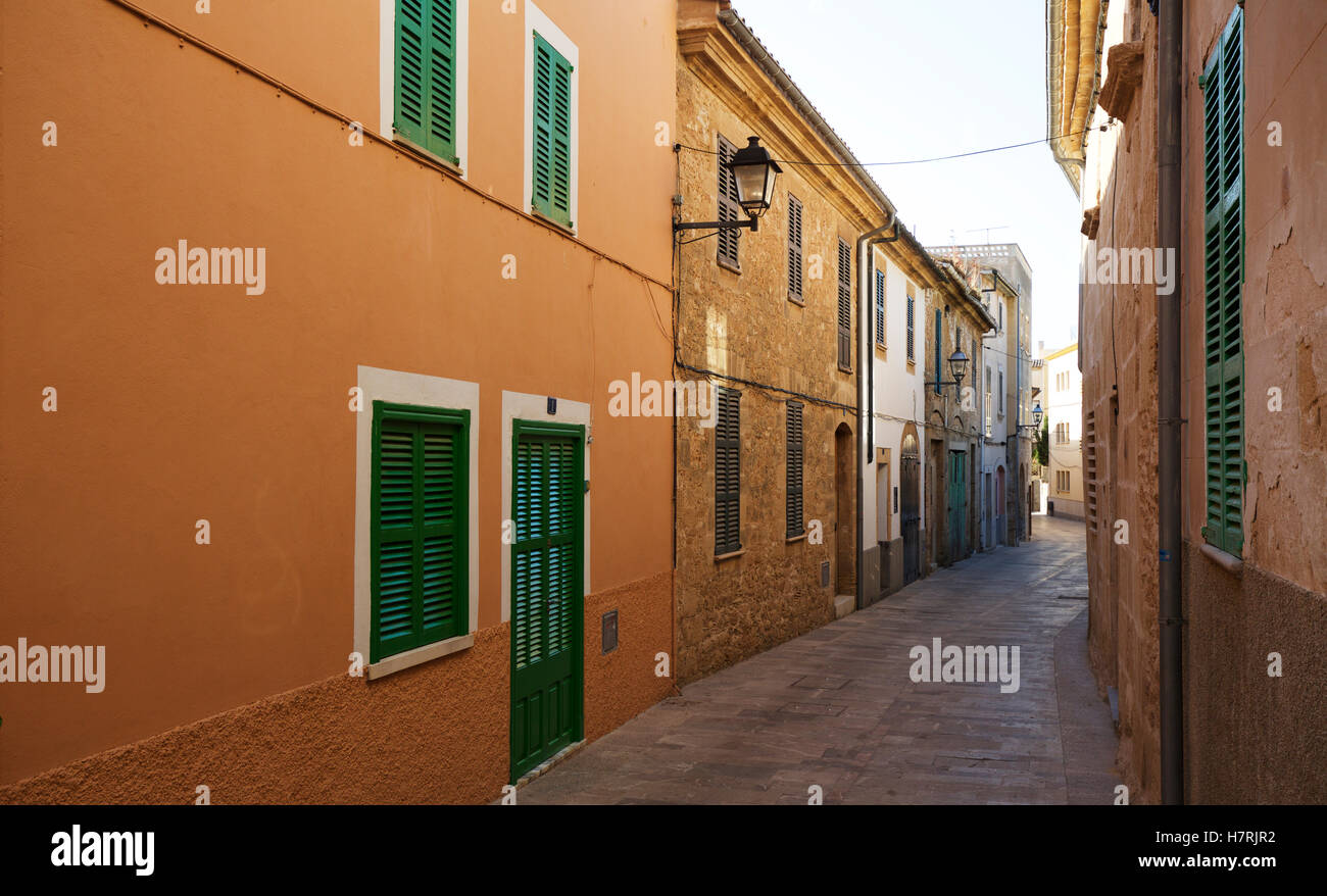 Winding backstreets lined with traditional house in the old town of ...