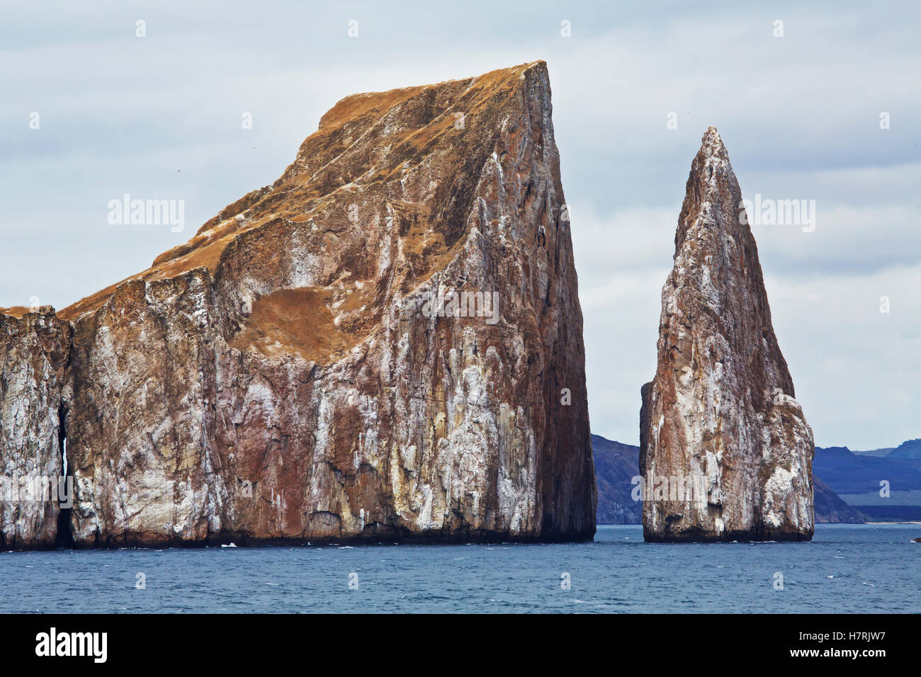 Eroded islet and rock stack at sea in Galapagos Stock Photo - Alamy