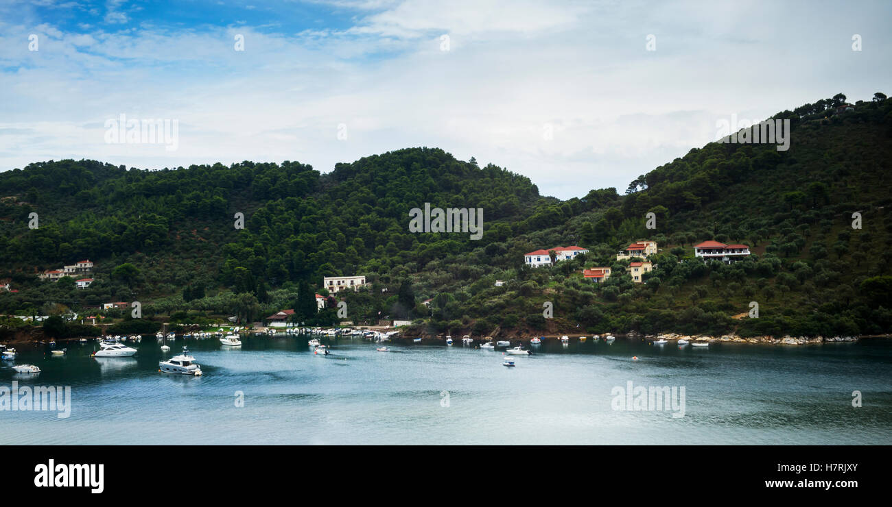 A village and harbour on a greek island; Panormos, Skiathos, Greece ...