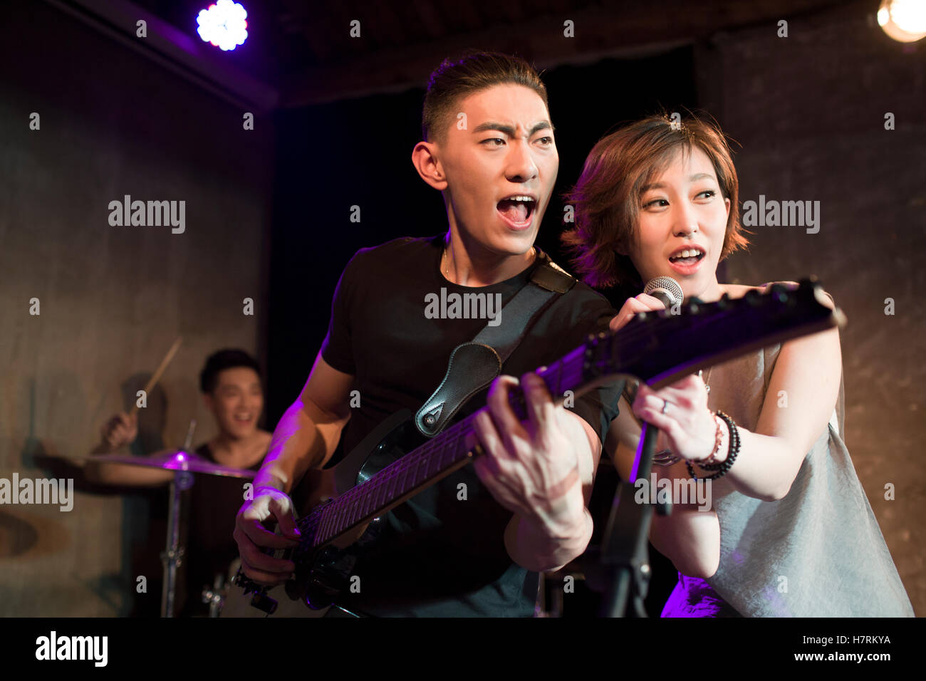 Chinese musical band performing on stage Stock Photo - Alamy