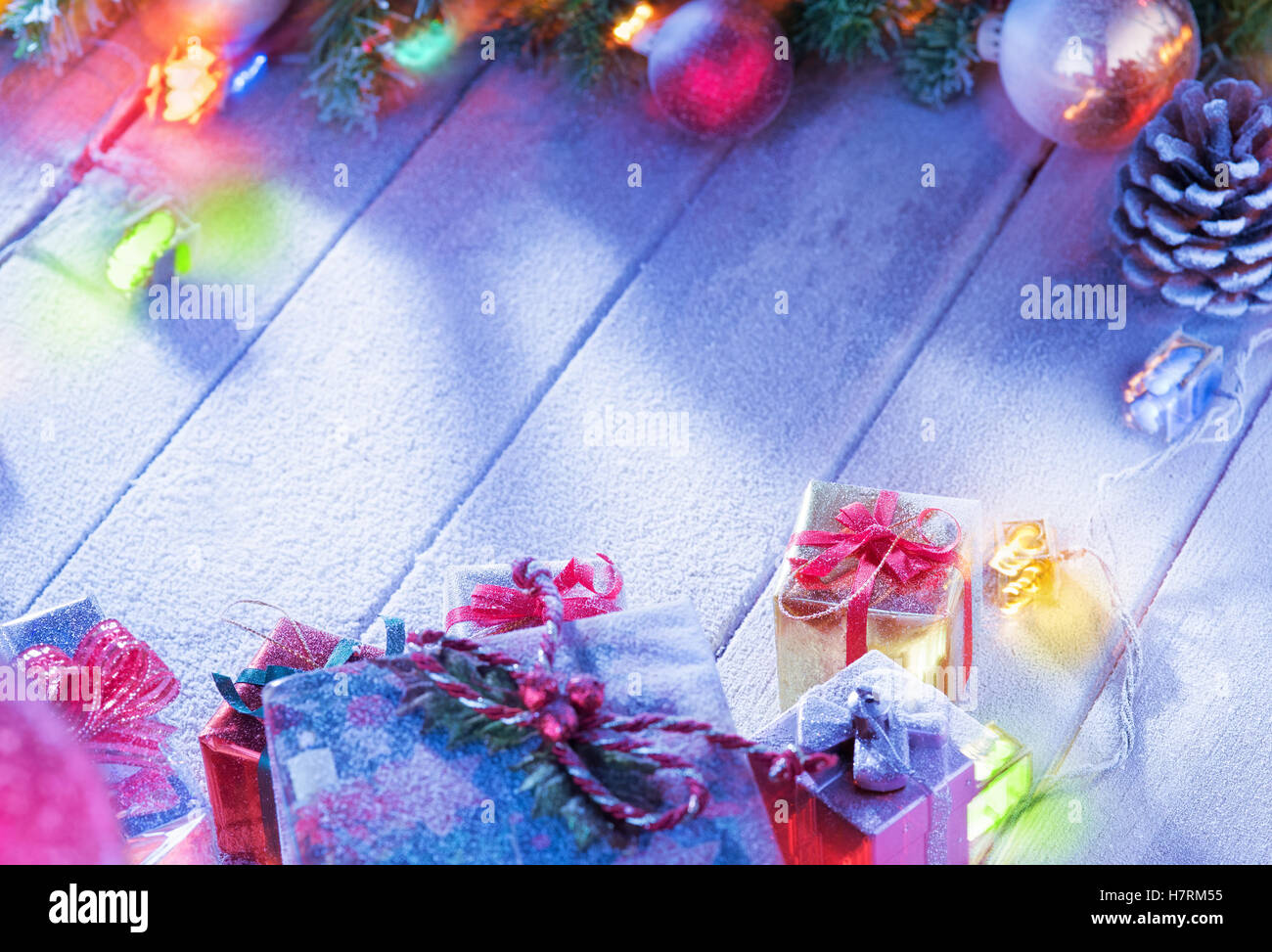close up view of gifts boxes on snowbound wooden back Stock Photo - Alamy