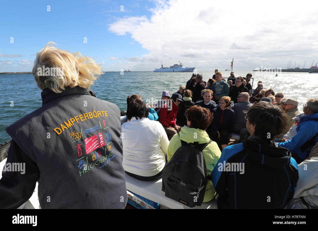 Helgoland, Germany. 29th Aug, 2016. Captain Klaus Koehn (back, covered ...