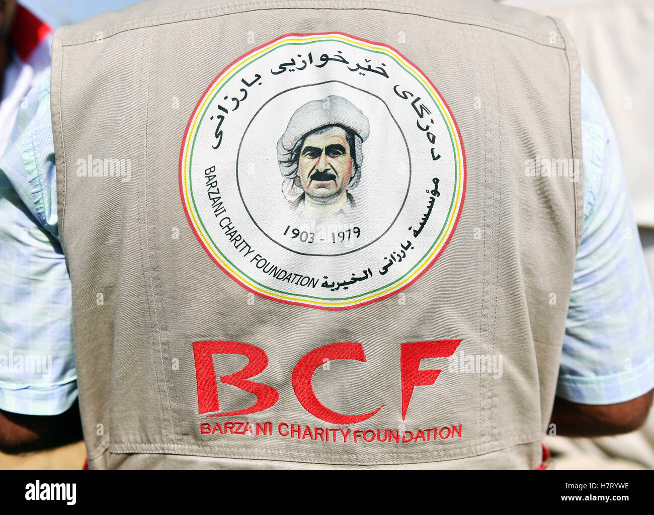 The logo of the Kurdish Barzani Charity Foundation (BCF) on the vest of ...