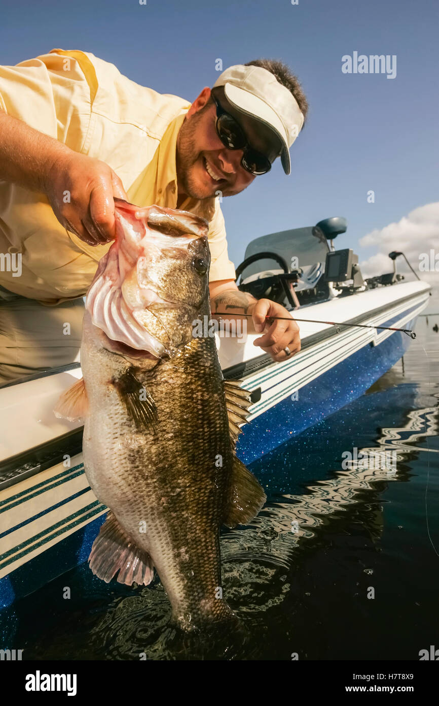 Bass Fisherman With Catch Stock Photo - Alamy
