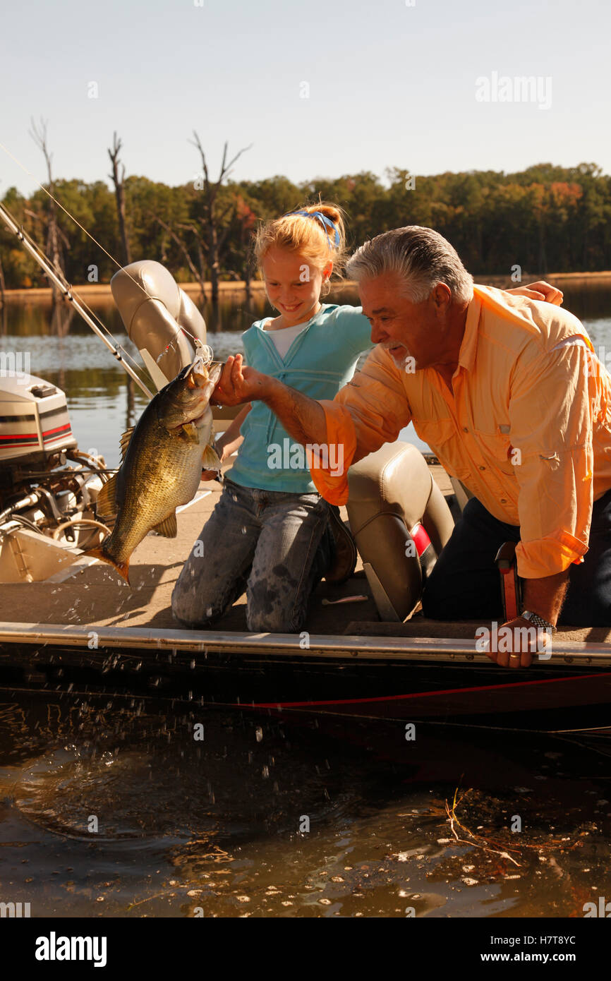 Grandfather And Grandson Fishing On Lake Stock Photo - Alamy
