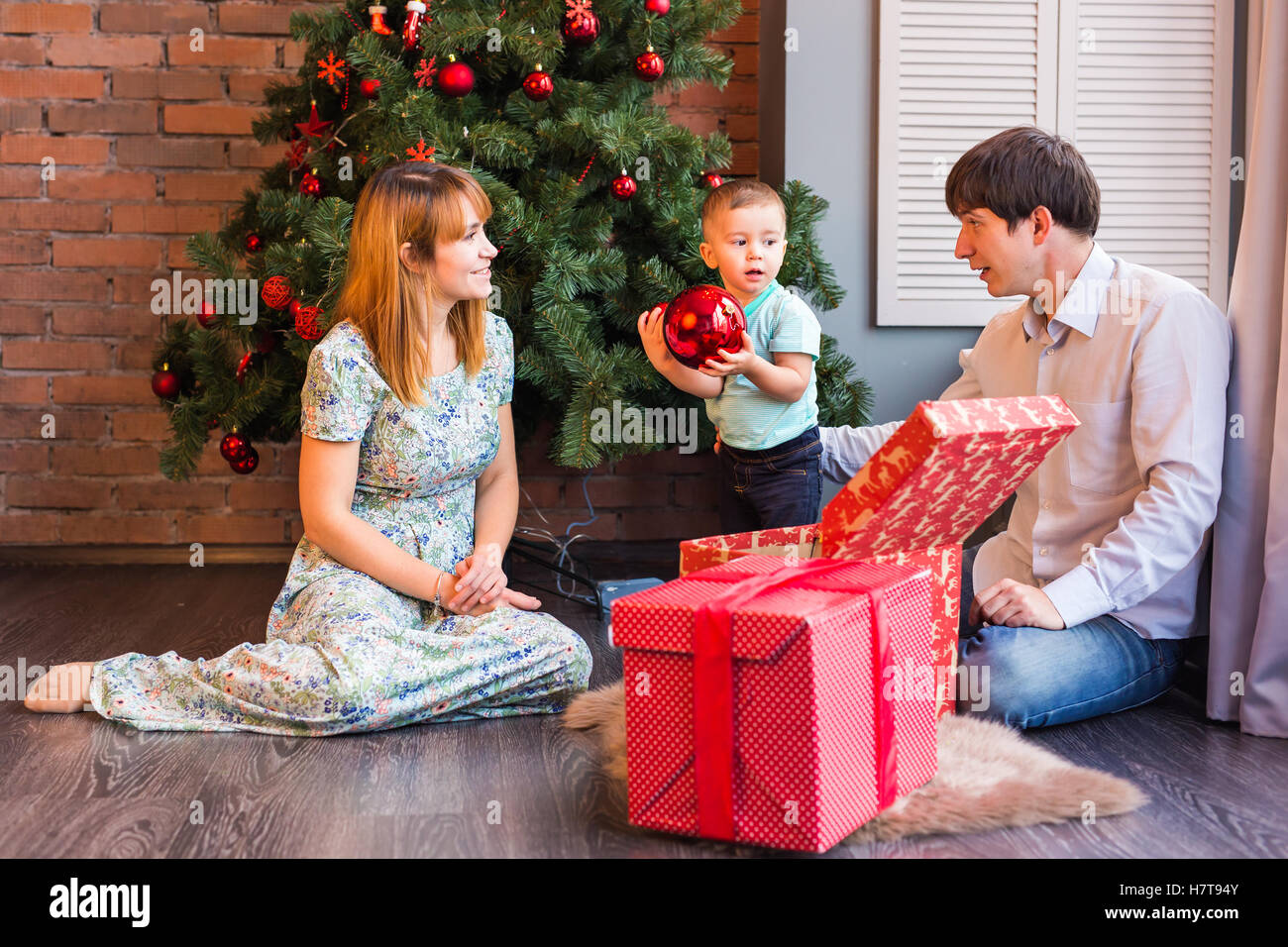 Christmas Family with child. Happy Smiling Parents and Children at Home ...