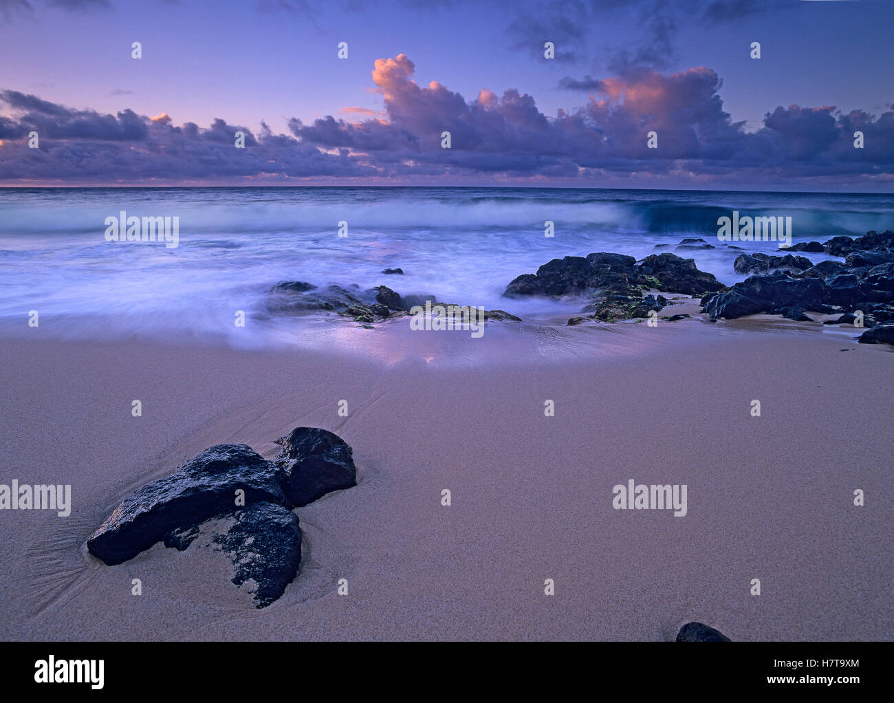 Lava rocks and surf on beach at sunset, Hawaii Stock Photo - Alamy