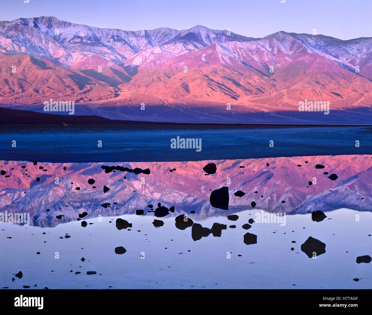 Panamint Range reflected in standing water at Badwater, Death Valley ...