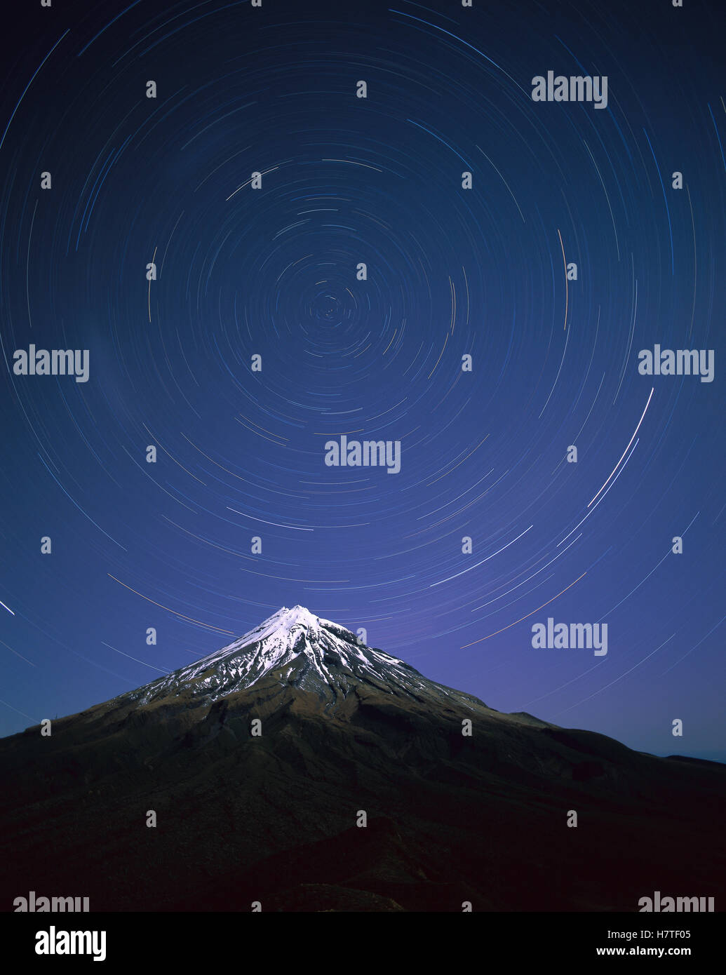 Star trails around the south celestial pole over Mt Taranaki, also ...