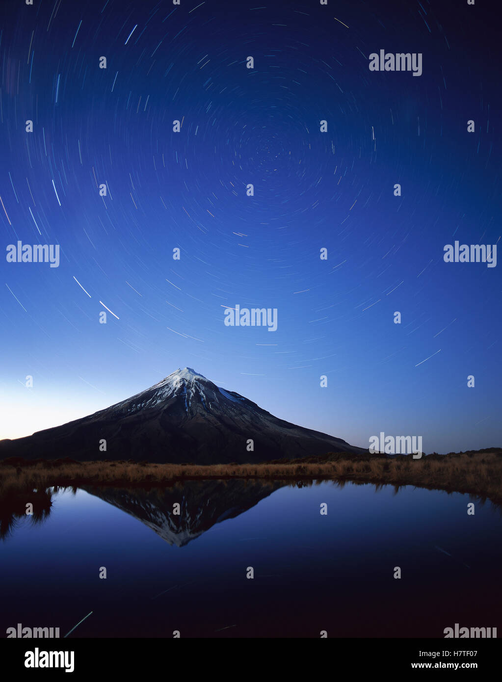 Star trails around the south celestial pole over Mt Taranaki, also ...