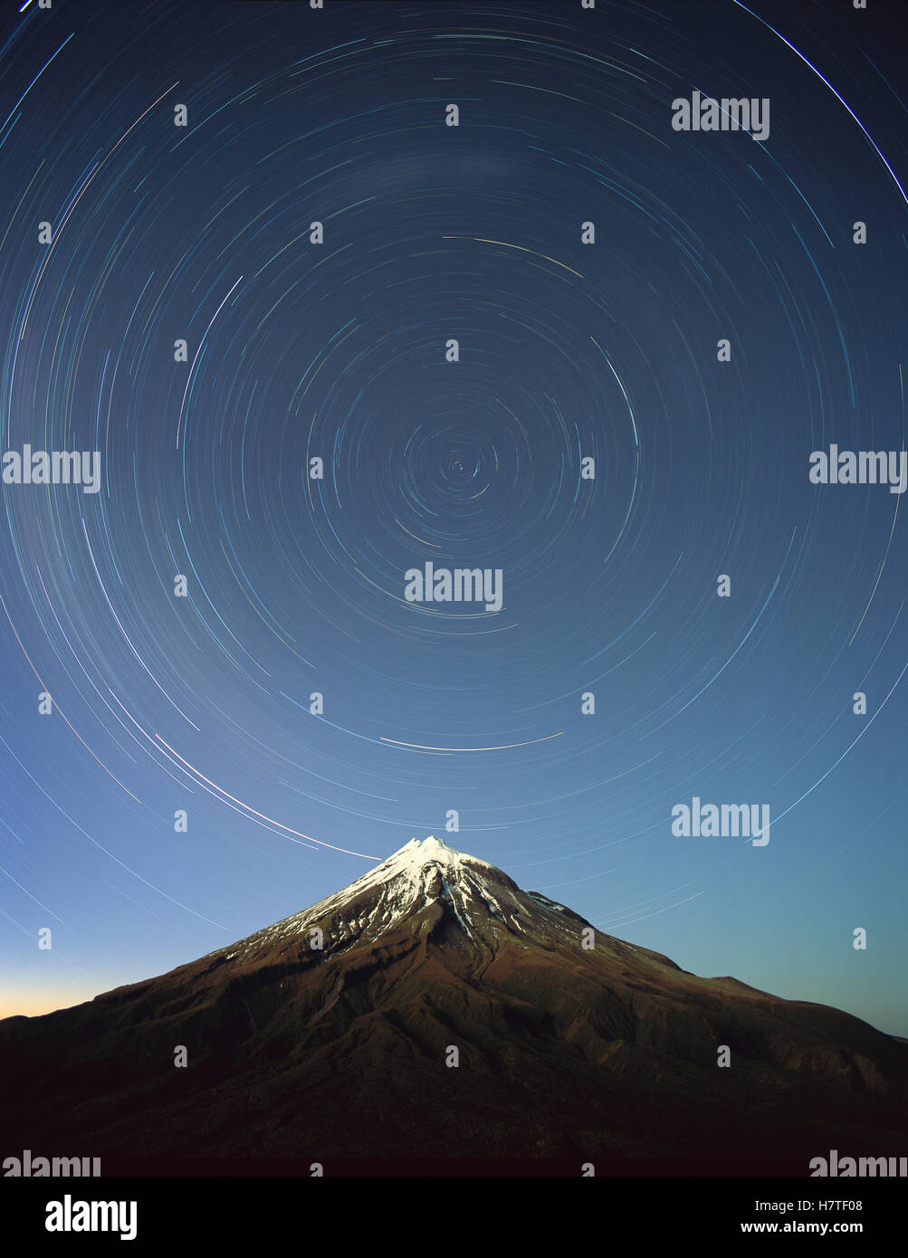 Star trails around the south celestial pole over Mt Taranaki, also ...