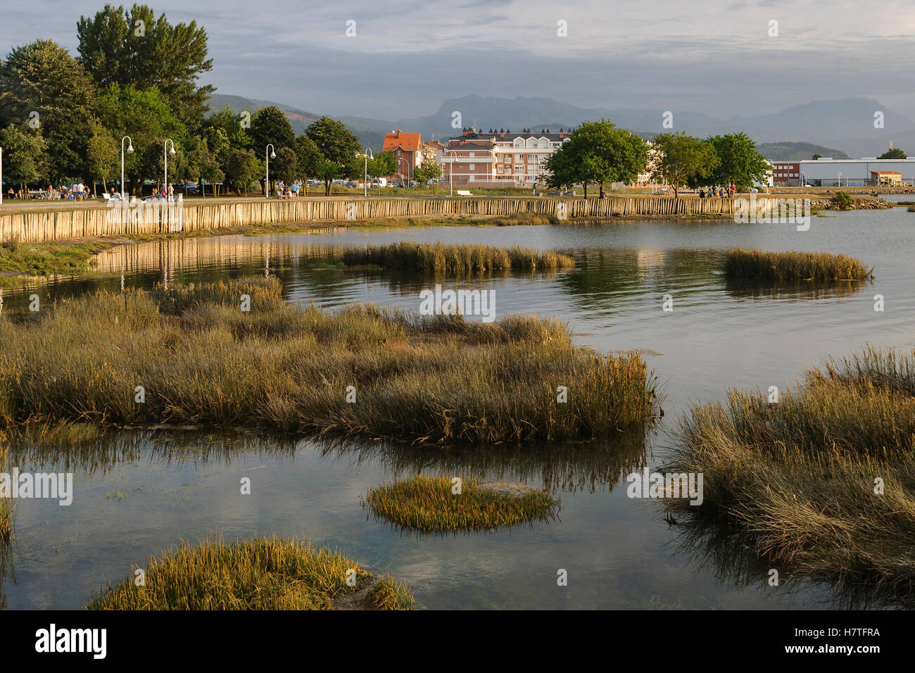 View of the promenade from the river Asón in the village of Colindres ...
