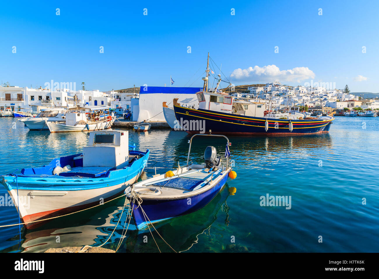 Traditional Greek fishing boats in Naoussa port at sunset time, Paros ...