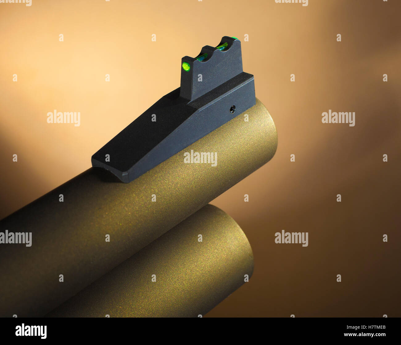 Fiber optic front sight on a gold colored shotgun Stock Photo - Alamy