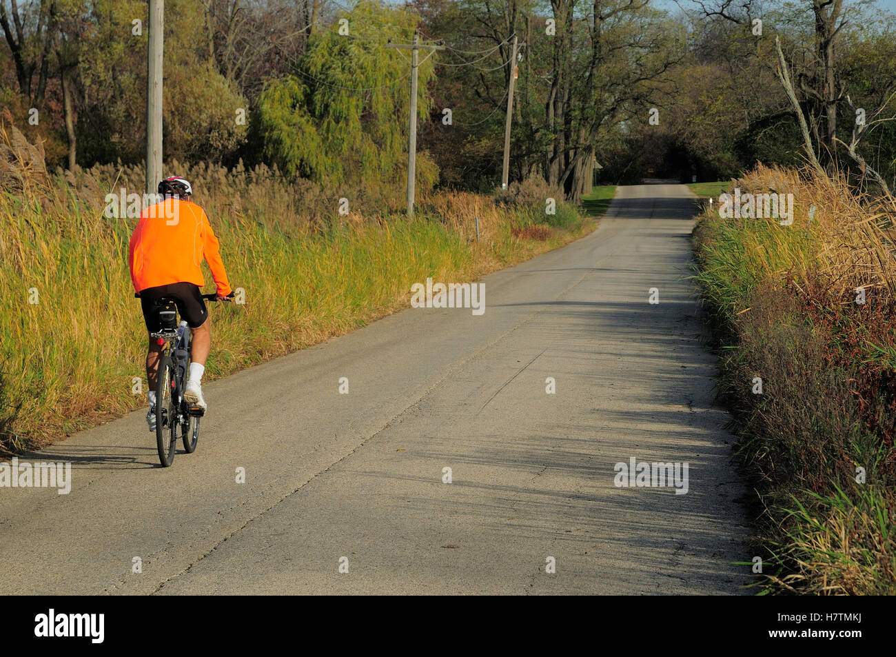 Riding bicycle on rural road hi-res stock photography and images - Alamy