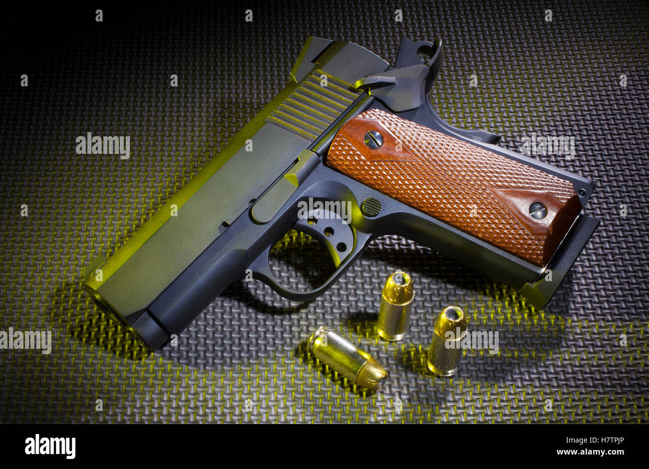 Hollow point bullets with a small semi automatic pistol Stock Photo - Alamy