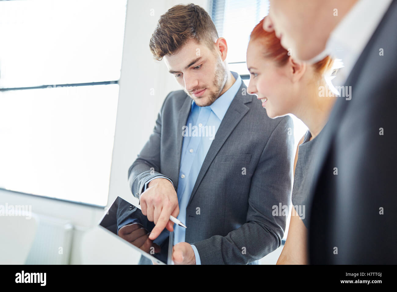 Business consulting people with tablet computer giving advice Stock ...