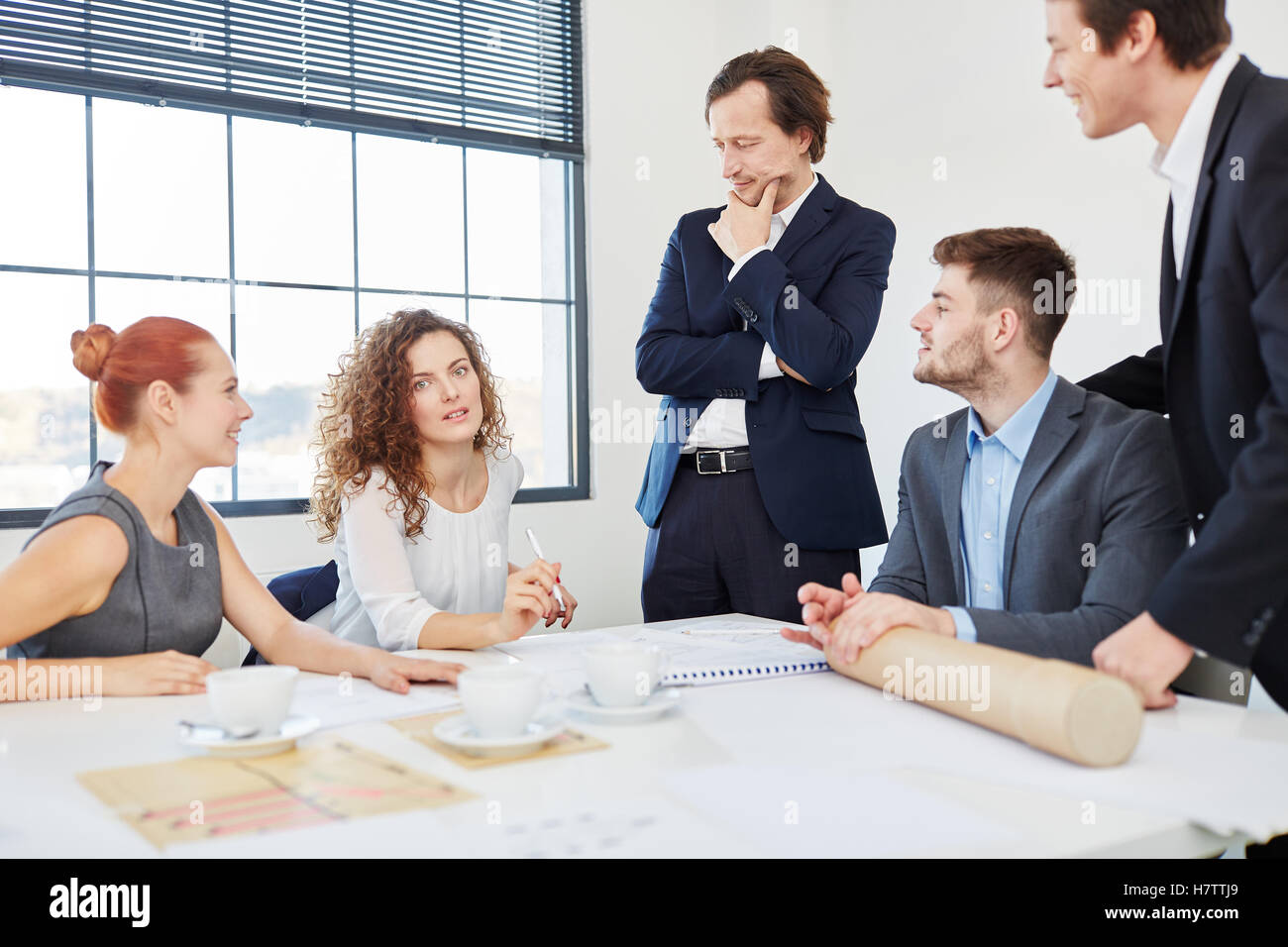 Business people in meeting discussing as team about success Stock Photo ...