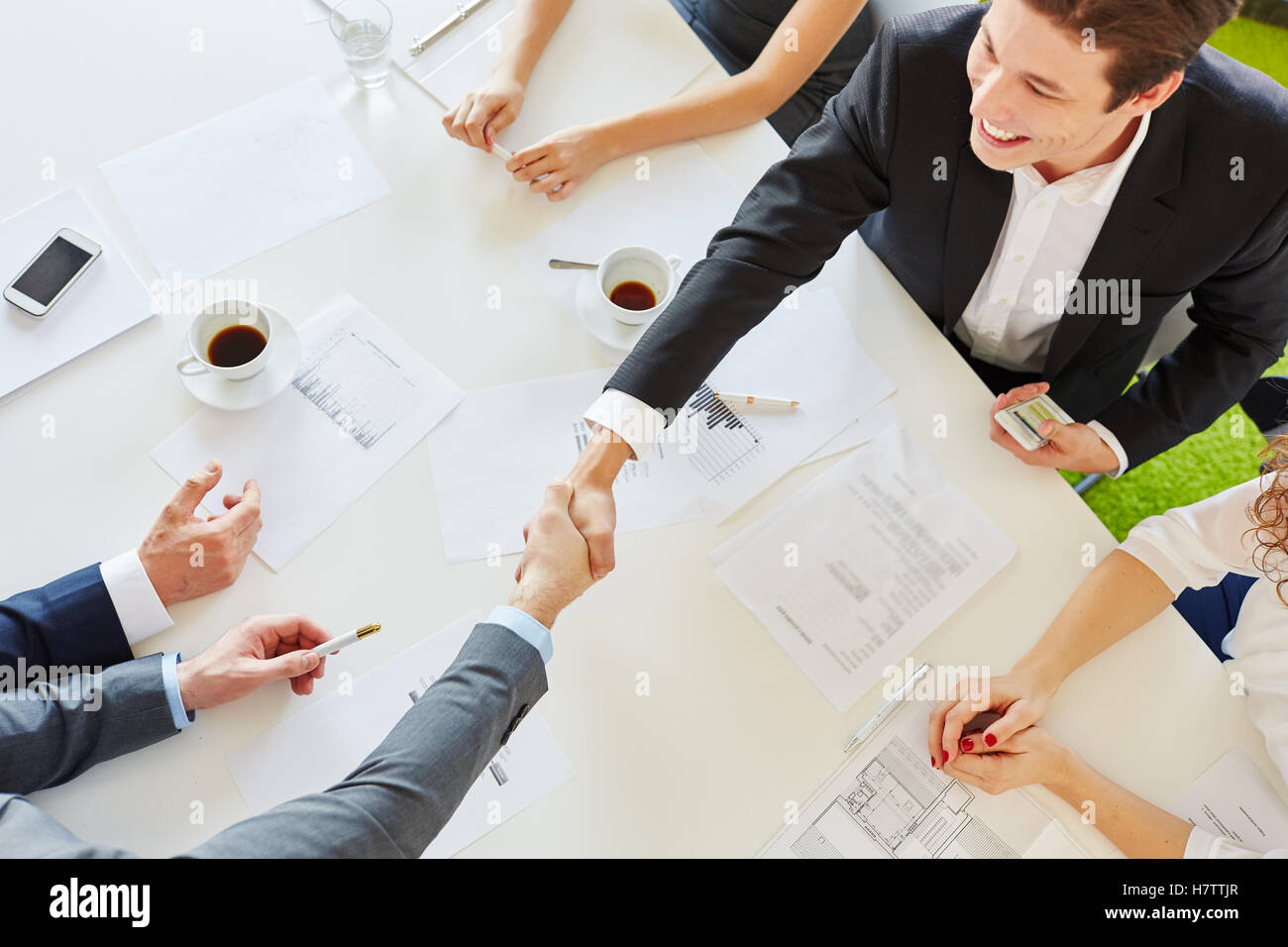 Business people handshake as sign of partnership Stock Photo - Alamy
