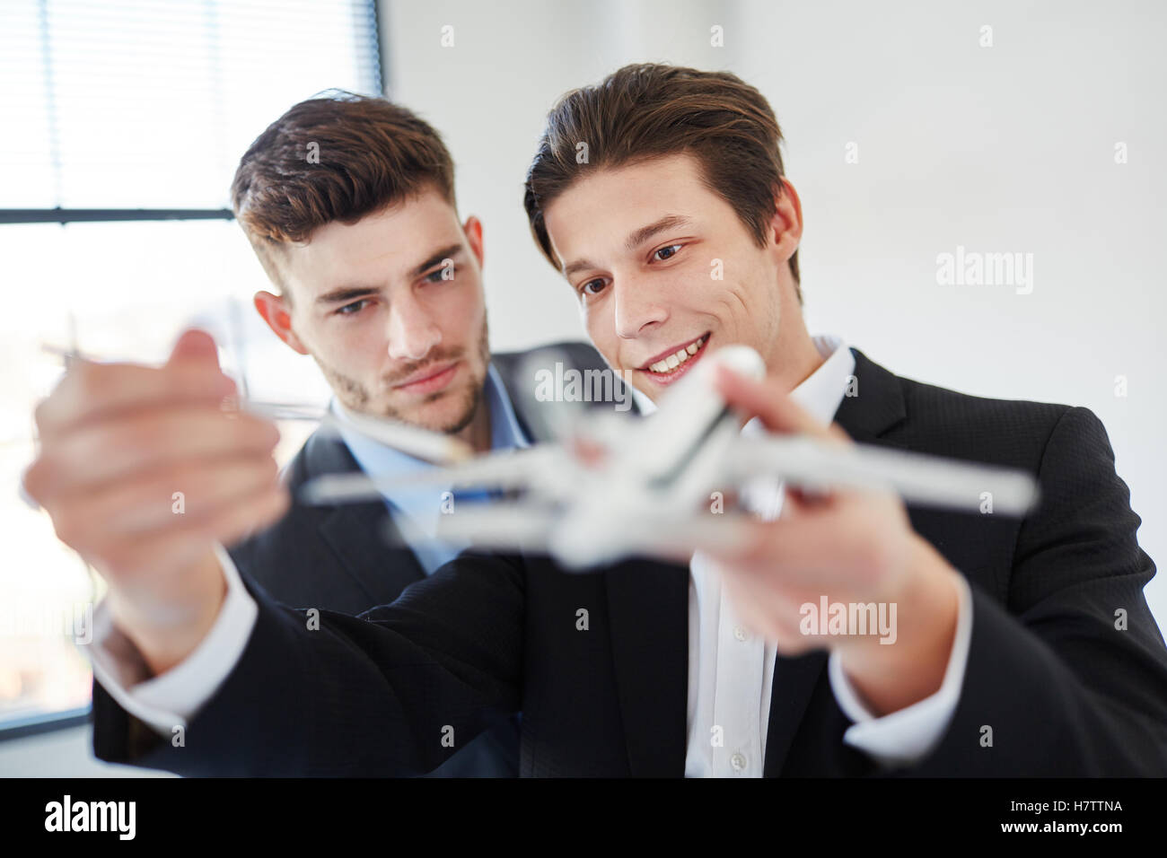 Designers having innovative idea for airplane design Stock Photo - Alamy