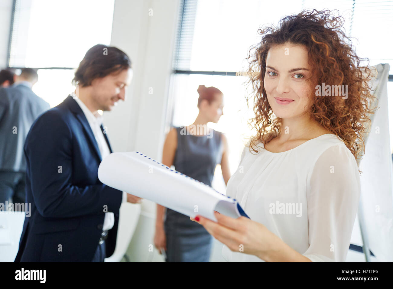 Businesswoman organizing workshop in office Stock Photo - Alamy