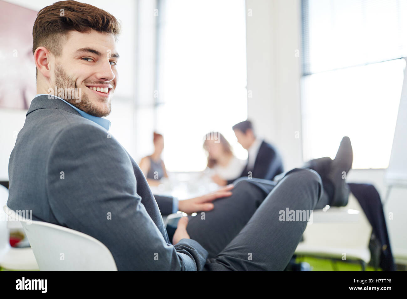Businessman taking a break with feet up Stock Photo - Alamy