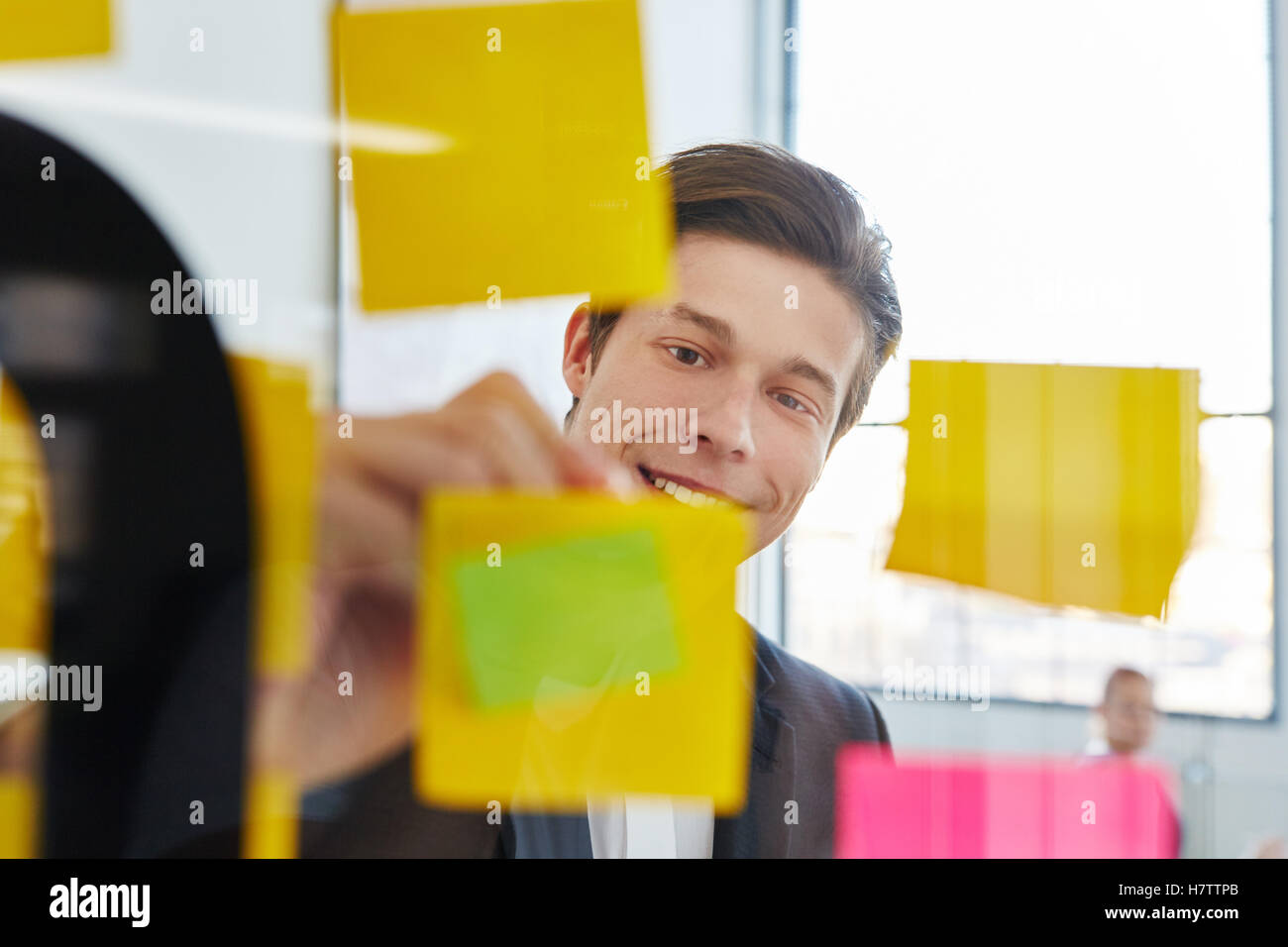 Brainstorming with sticky notes in business meeting Stock Photo - Alamy