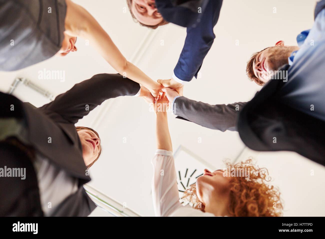 Successful team giving group High Five for team spirit lifting Stock ...