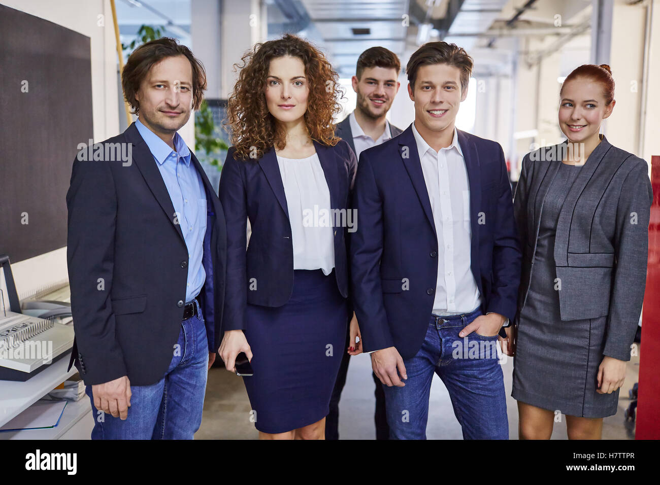 Portrait of competent business team in office Stock Photo - Alamy