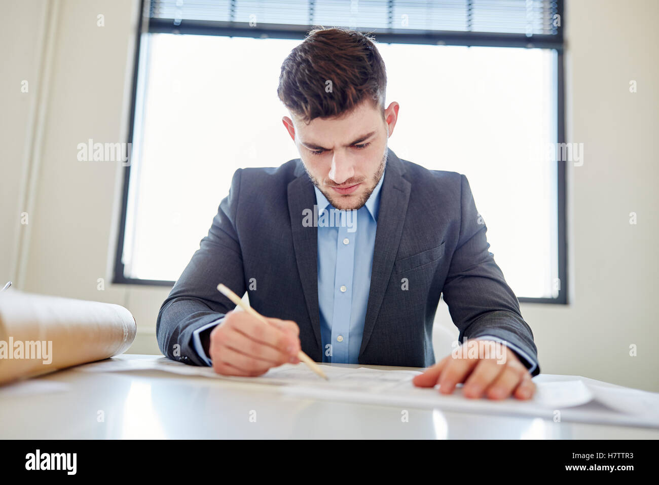 Businessman in deep concentration planning and thinking Stock Photo - Alamy