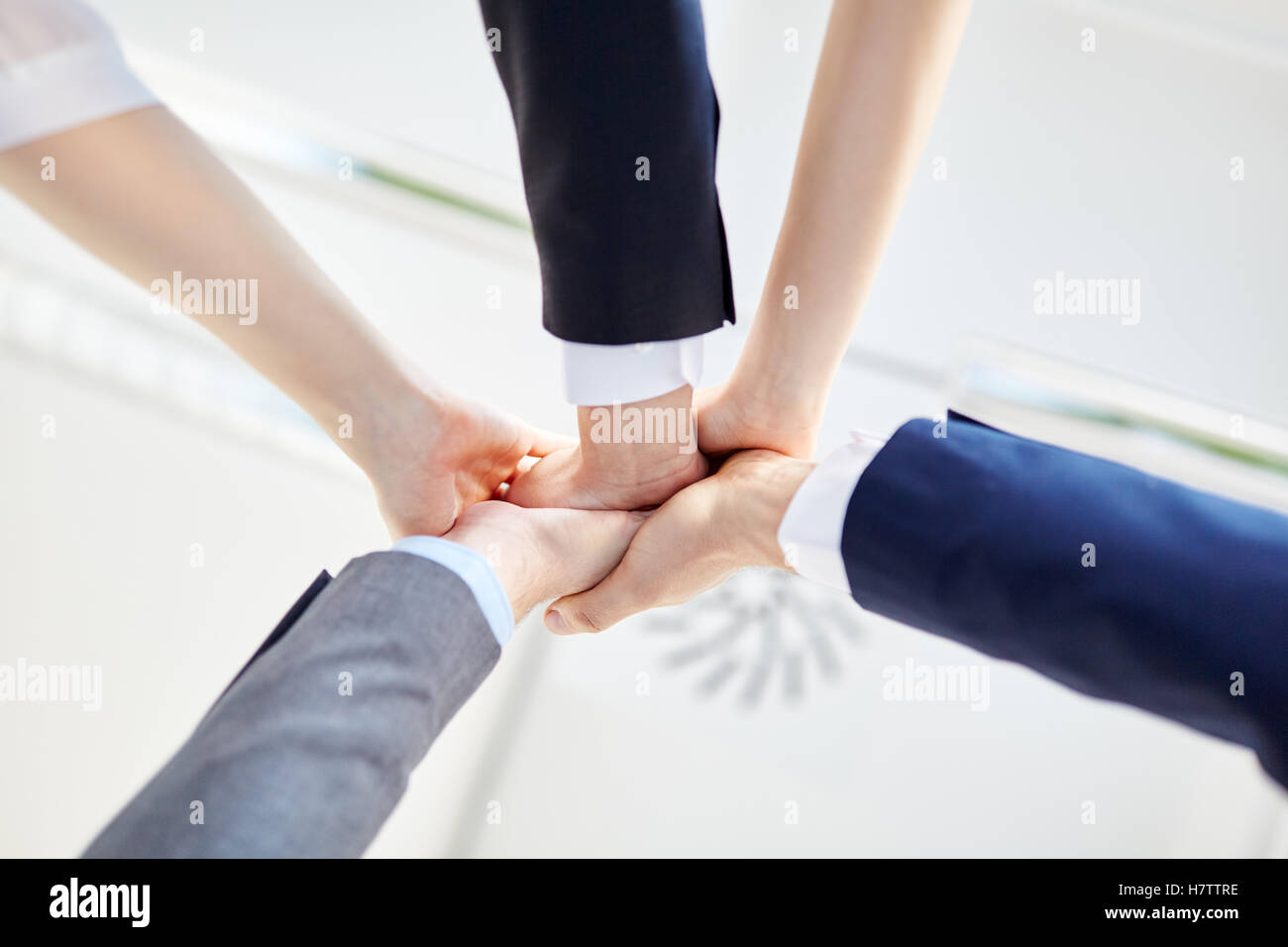 Group high five as motivation in start-up celebration Stock Photo - Alamy
