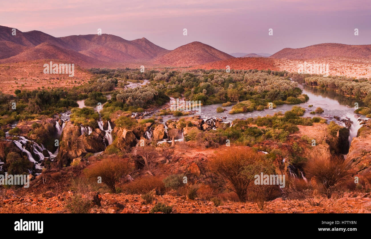Epupa Falls on the Kunene River just after sunset, Namibia Stock Photo ...