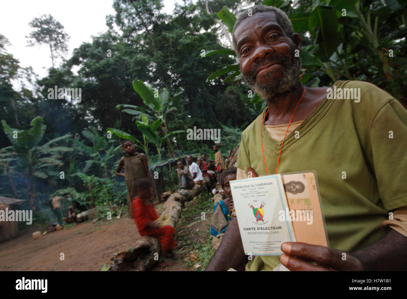 Baka man holding his identification that show that he is the oldest ...