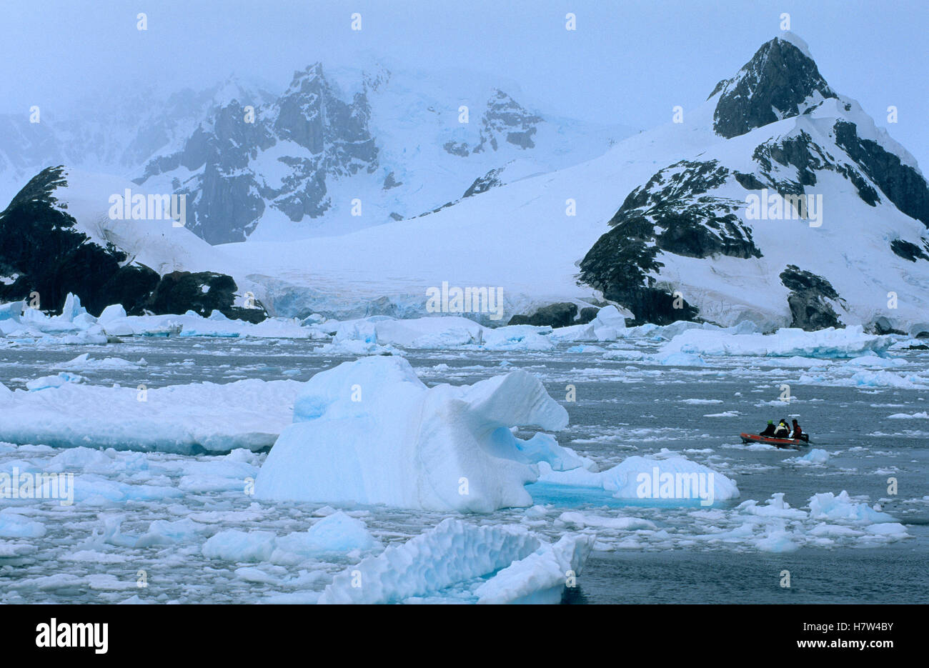 Explorers riding through sea ice to land, Antarctica Stock Photo - Alamy