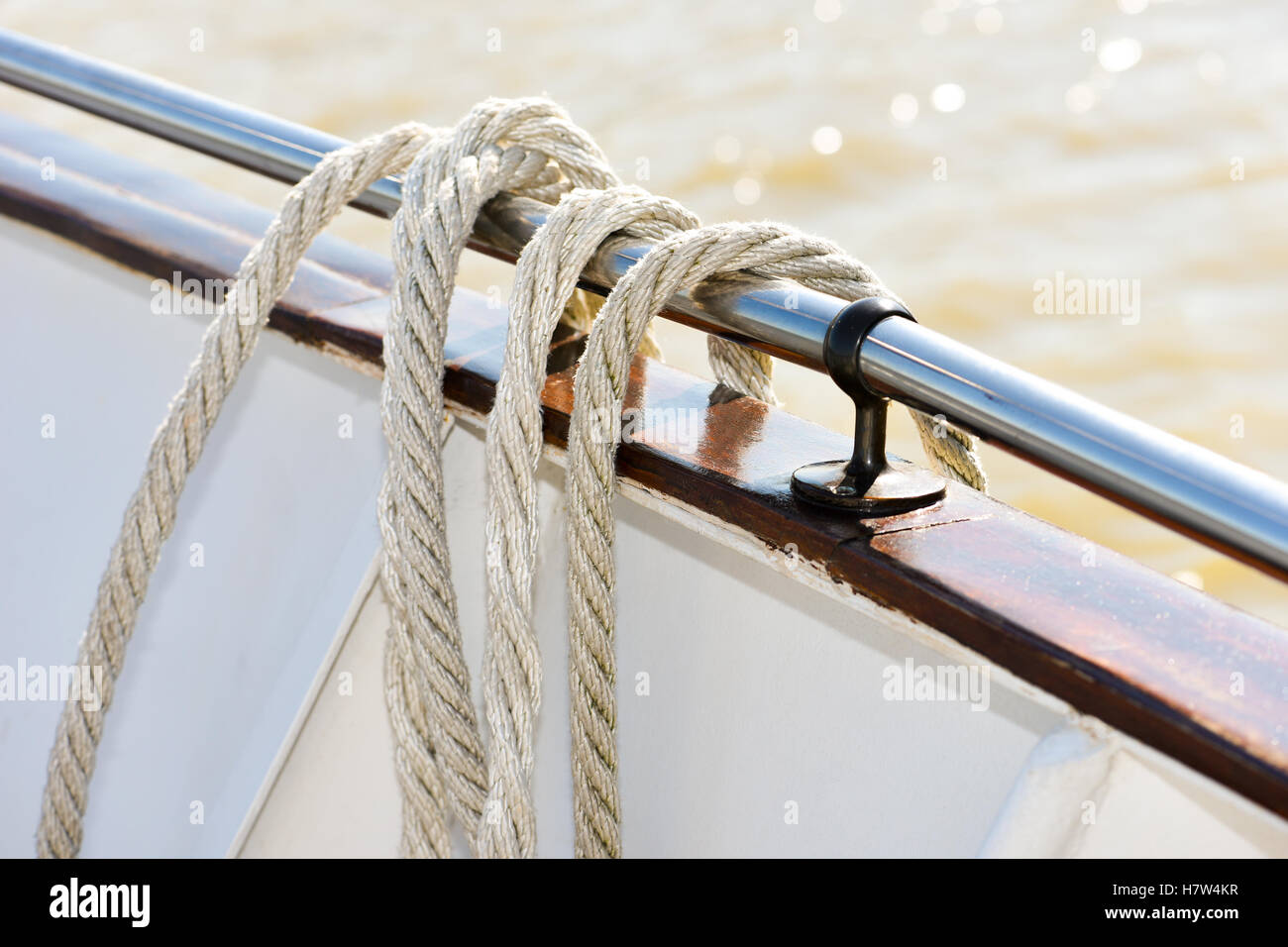 Rope hanging from the side of a boat Stock Photo - Alamy
