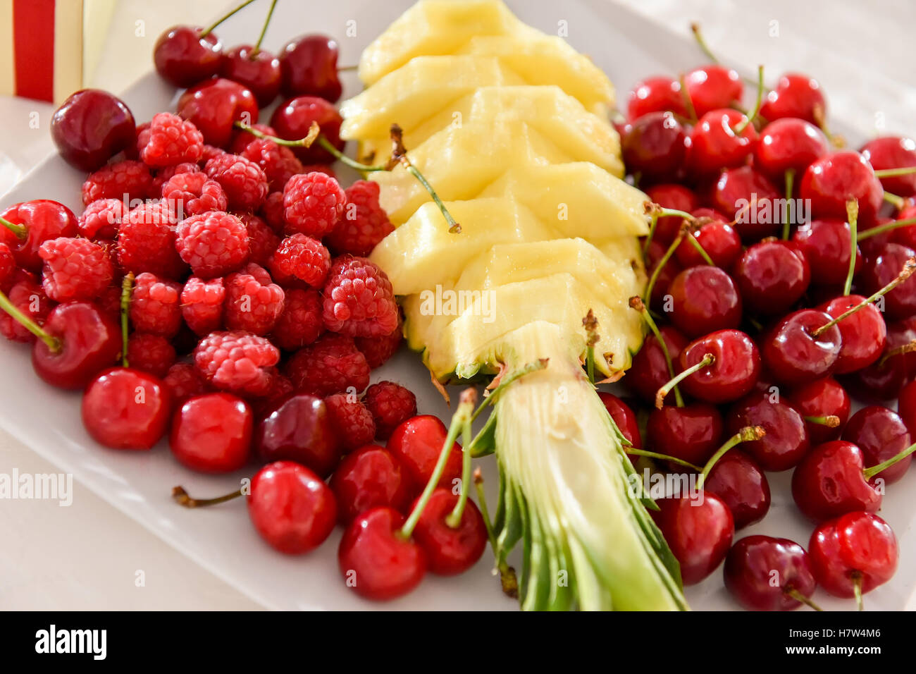 Cherry, raspberry, pineapple plateau Stock Photo - Alamy