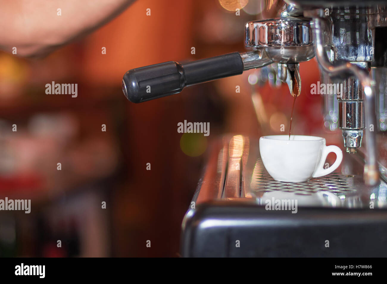 Espresso machine making coffee, golden espresso flowing. Coffee ...