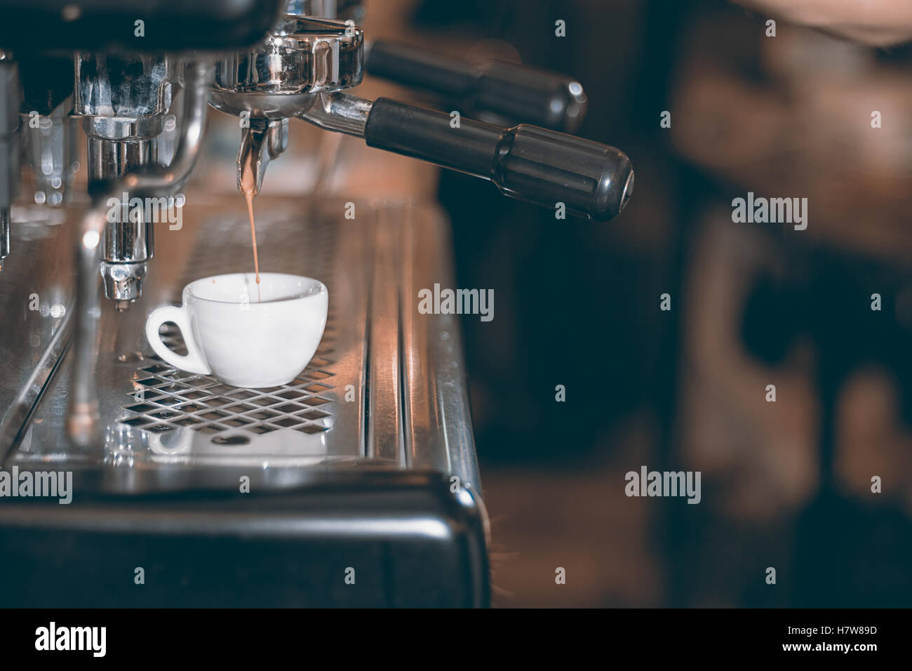 Espresso machine making coffee, golden espresso flowing. Coffee ...