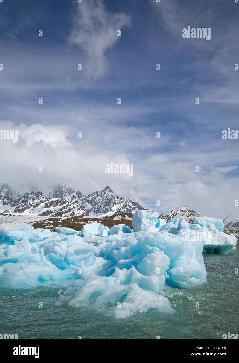 Blue iceberg and ice floes floating in sea near Neumayer Glacier, South ...