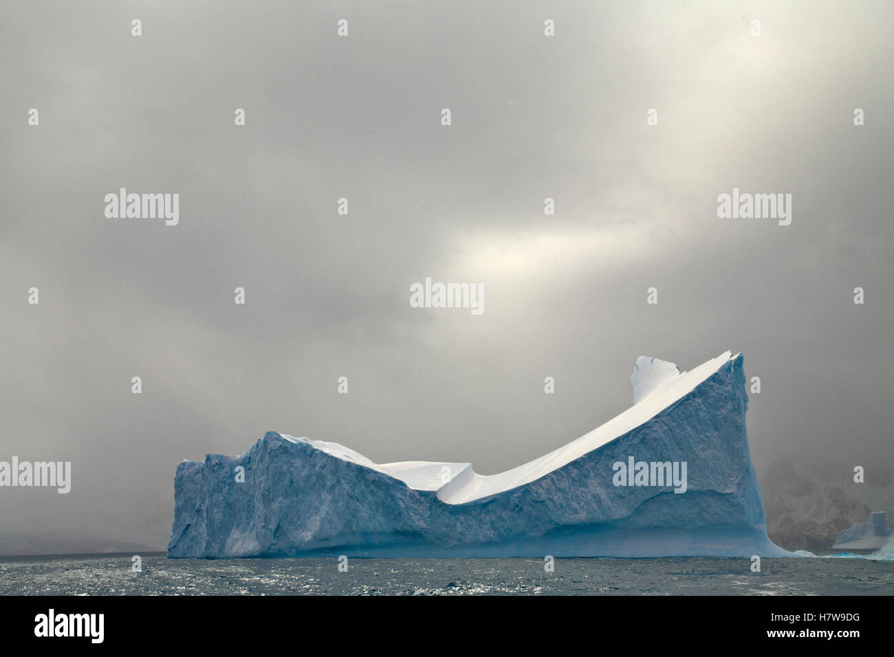 Flat tabular iceberg floating in dark sea, South Georgia Island Stock ...