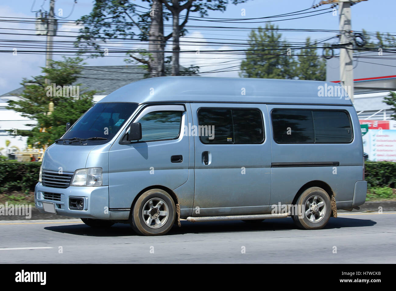 Blue Nissan Urvan Van Car on Highway road Stock Photo - Alamy