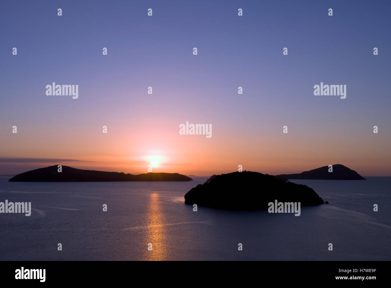 Sunset over water, Coromandel Peninsula, New Zealand Stock Photo - Alamy