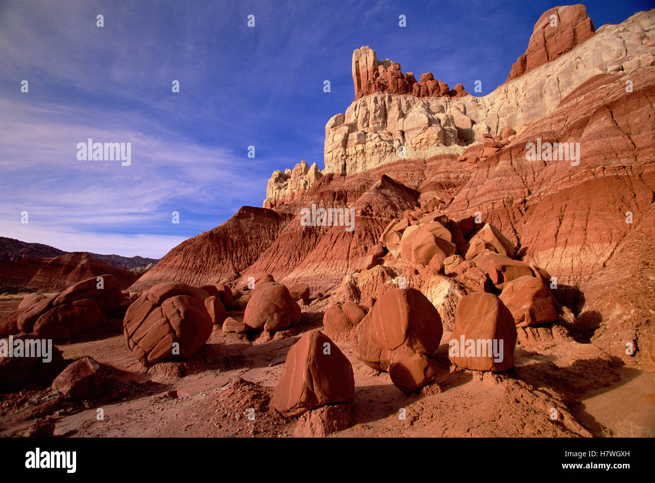 Sandstone buttes, eroded slopes, boulders, spring, Escalante Grand ...