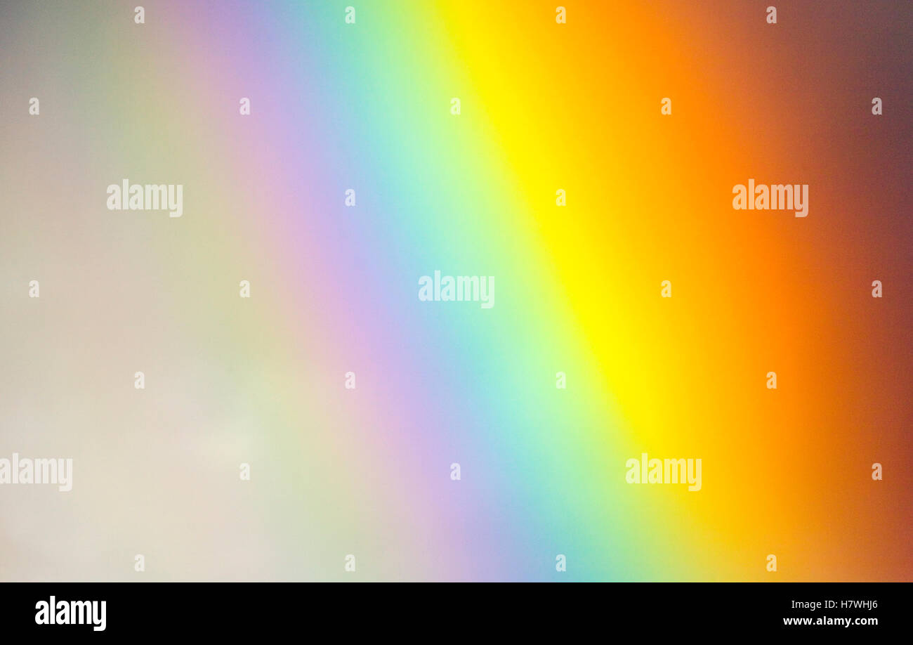 Bright rainbow (close up) spreading after late fall afternoon rain ...