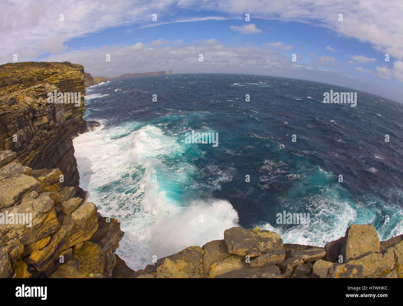 Rocky seashore, steep cliffs with colorful lichens, Beaver Island ...