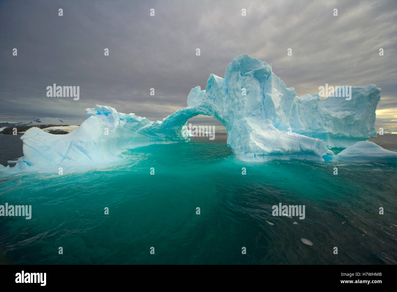 Giant iceberg arch formed by ice melting and wave action, Antarctica ...