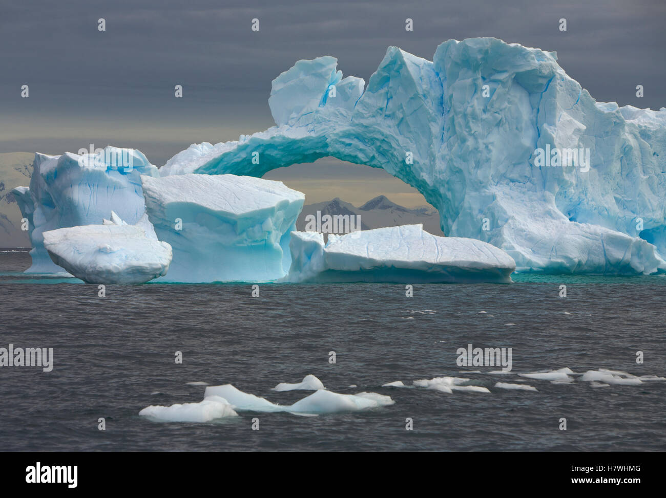 Giant iceberg arch formed by ice melting and wave action, Antarctica ...