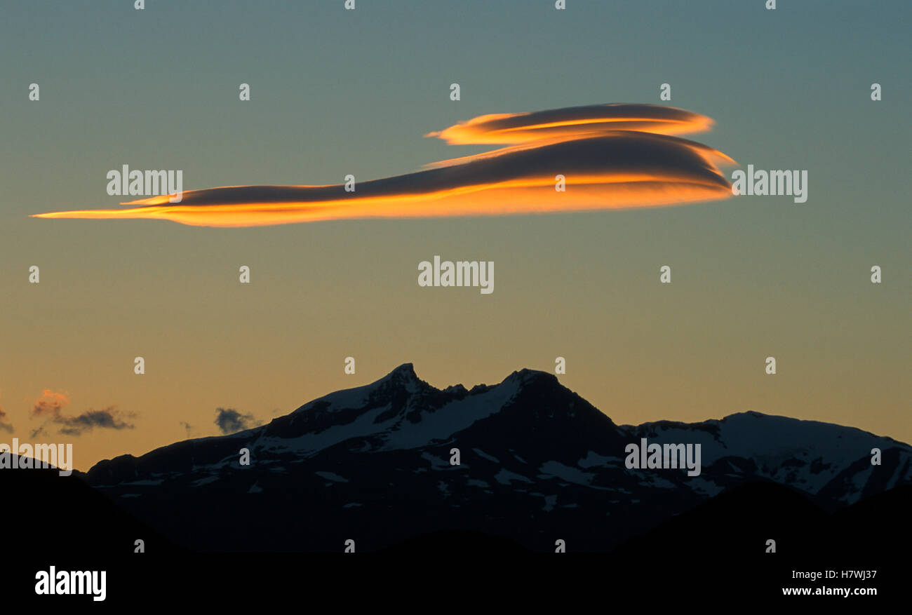 Lenticular cloud formation high above mountain summit, Torres del Paine ...